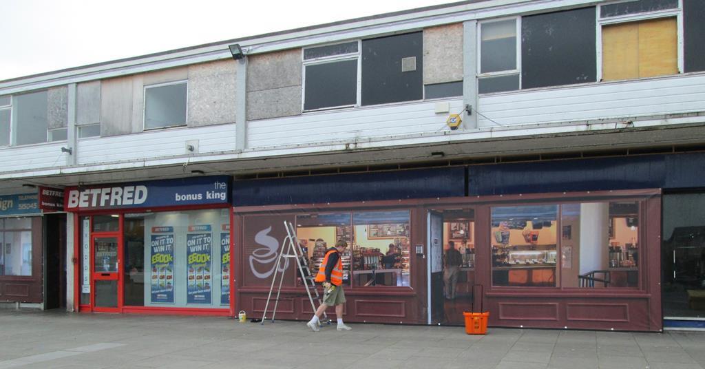 Vacant shops at Coronation Square shrouded in vinyl to attract new ...